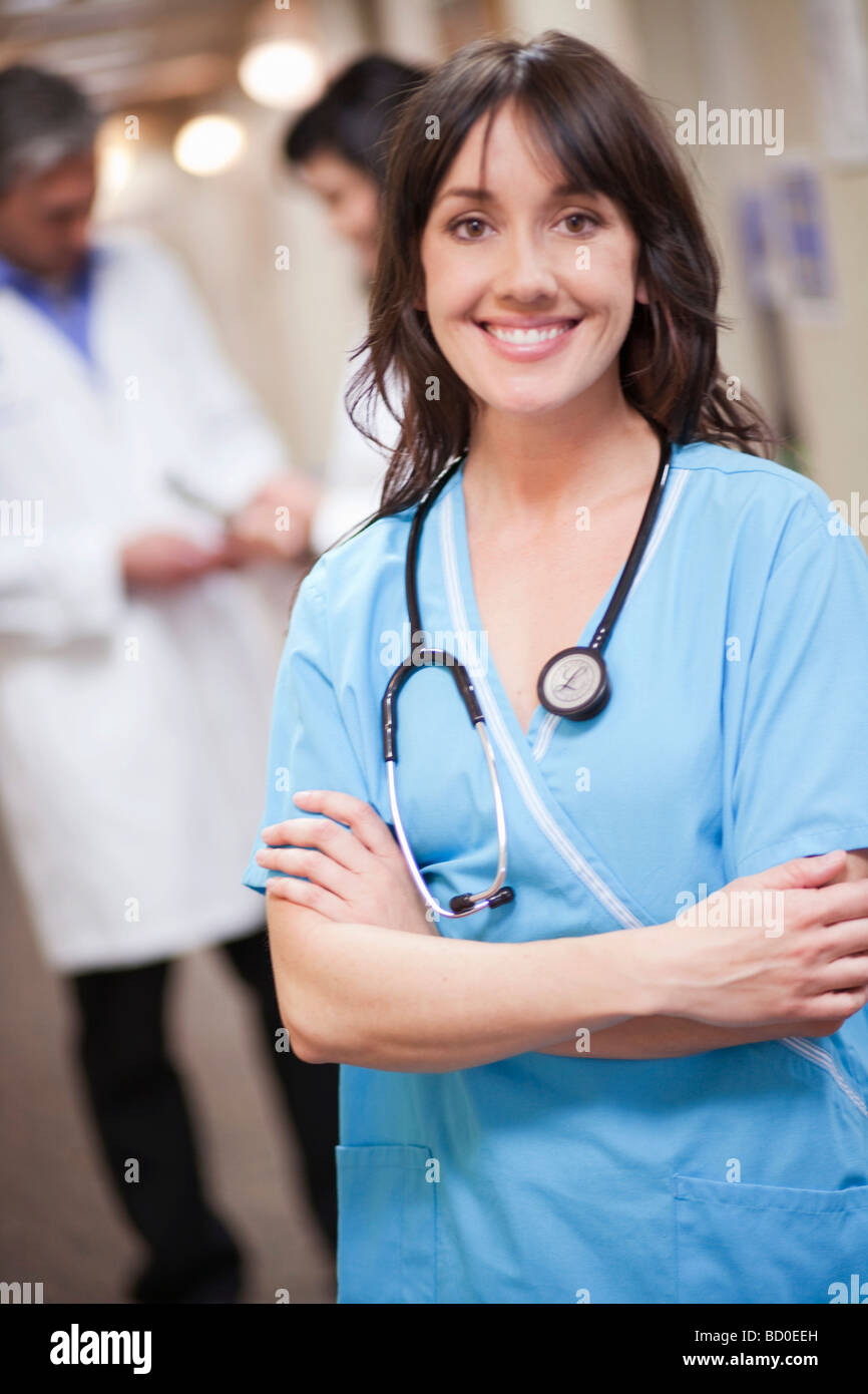 Female nurse smiling Stock Photo - Alamy