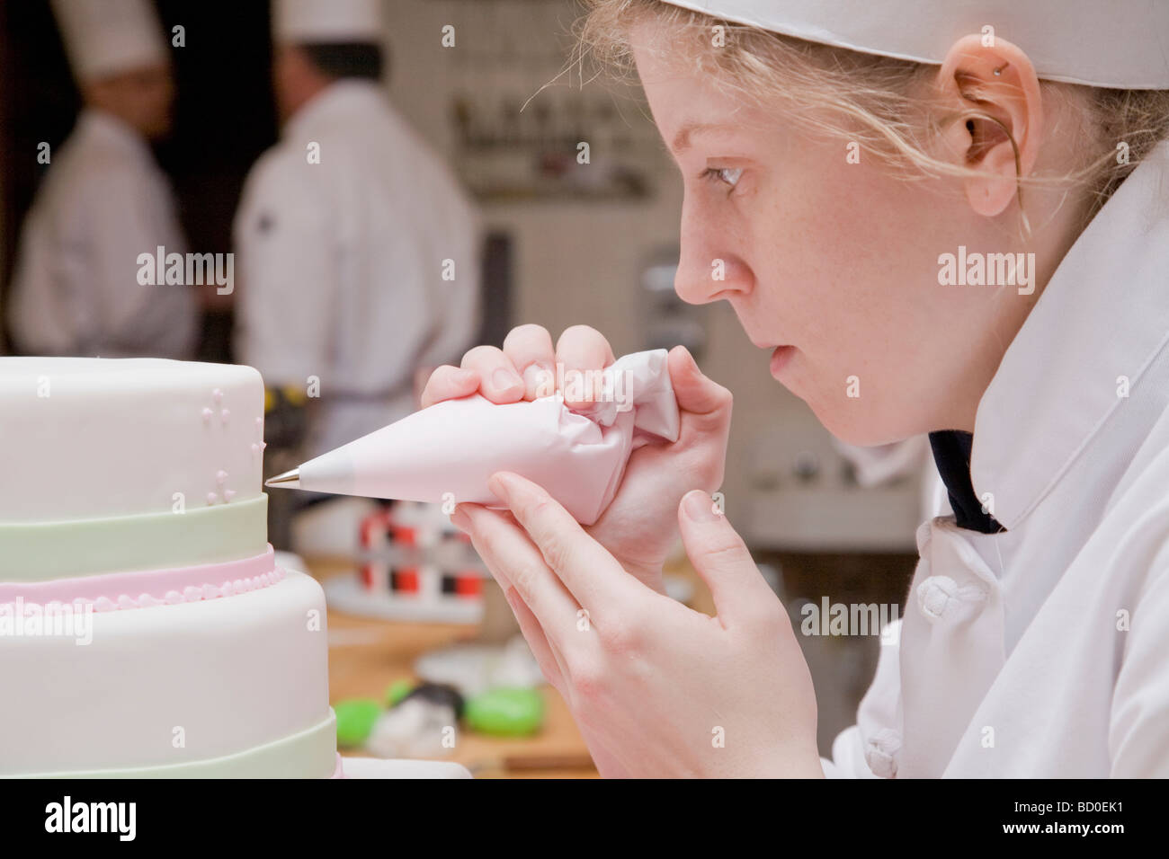 Woman frosting a cake Stock Photo - Alamy