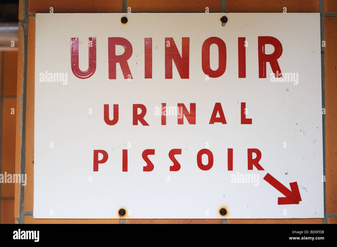 A sign for Urinoir Urinal Pissoir Stock Photo - Alamy