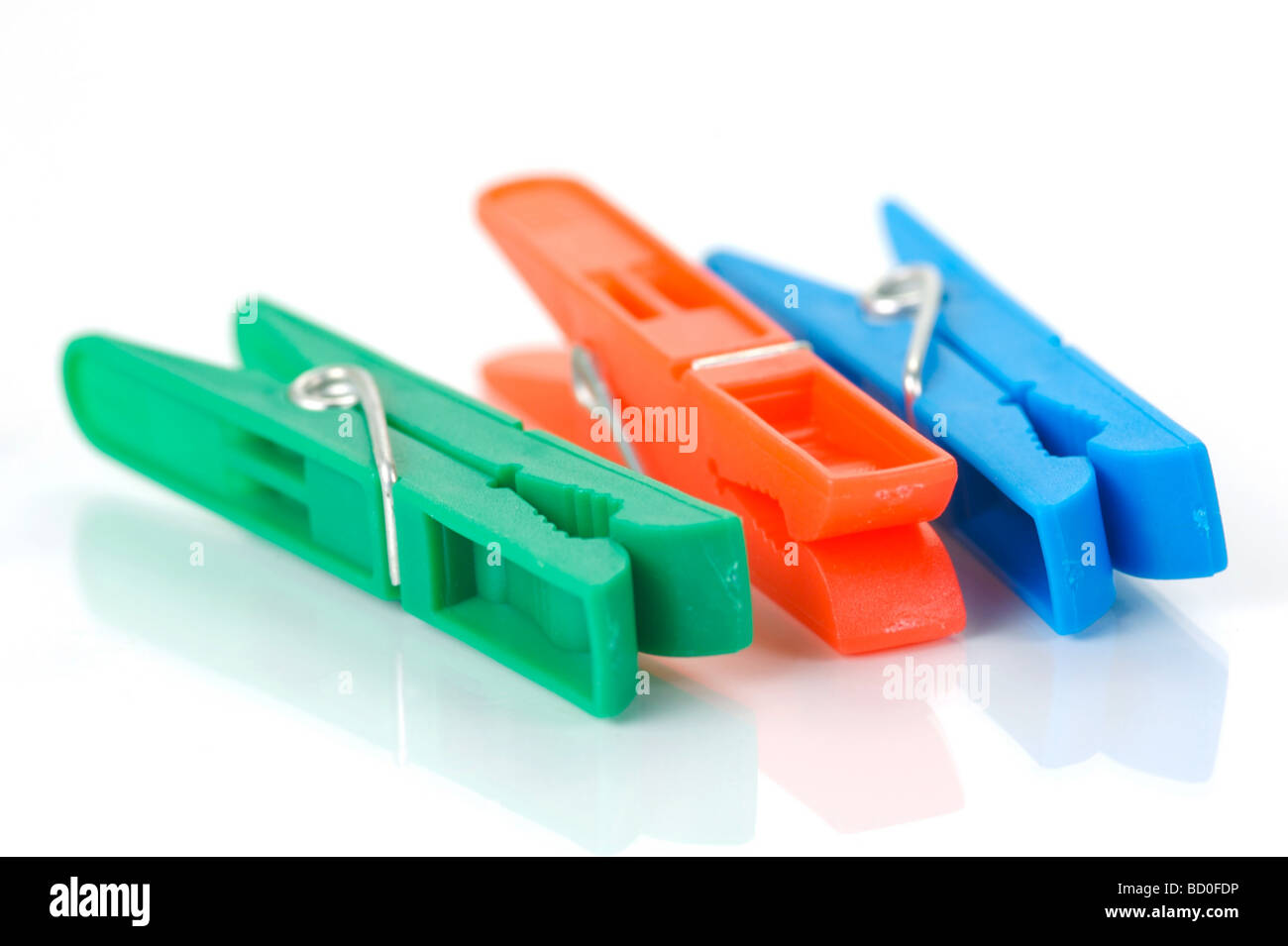 Clothes pegs isolated against a white background Stock Photo - Alamy