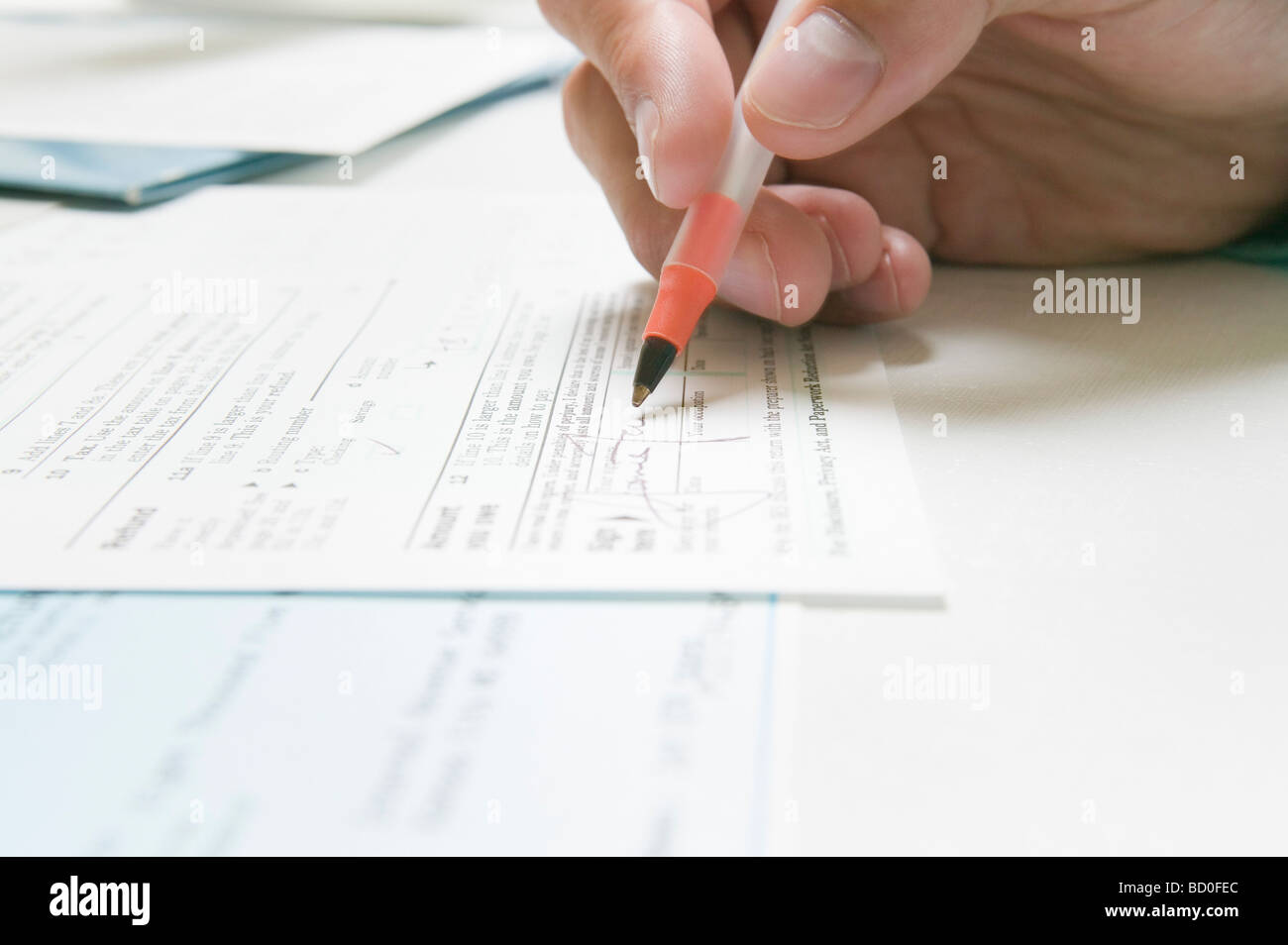 Signing tax form hi-res stock photography and images - Alamy
