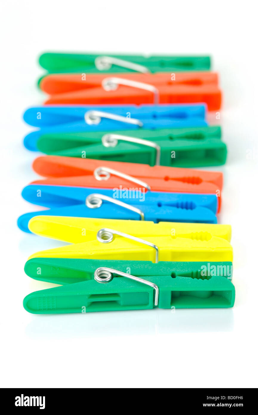 Clothes pegs isolated against a white background Stock Photo - Alamy