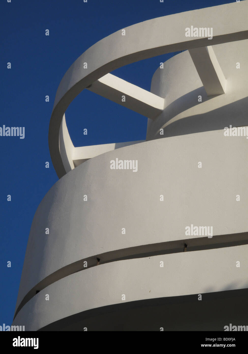 Protruding streamline balcony and a thin curved concrete shade of an ...