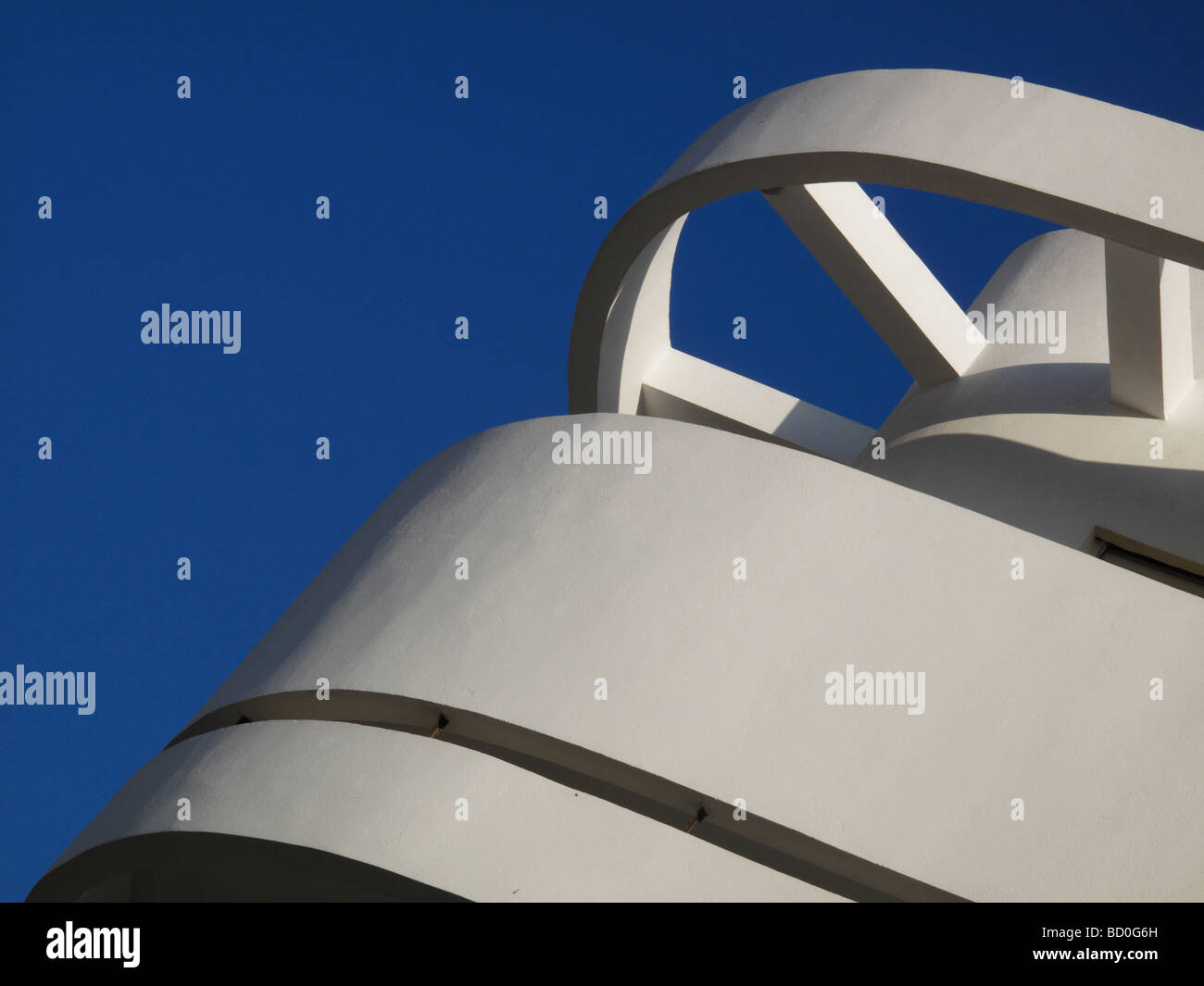 Protruding streamline balcony and a thin curved concrete shade of an ...