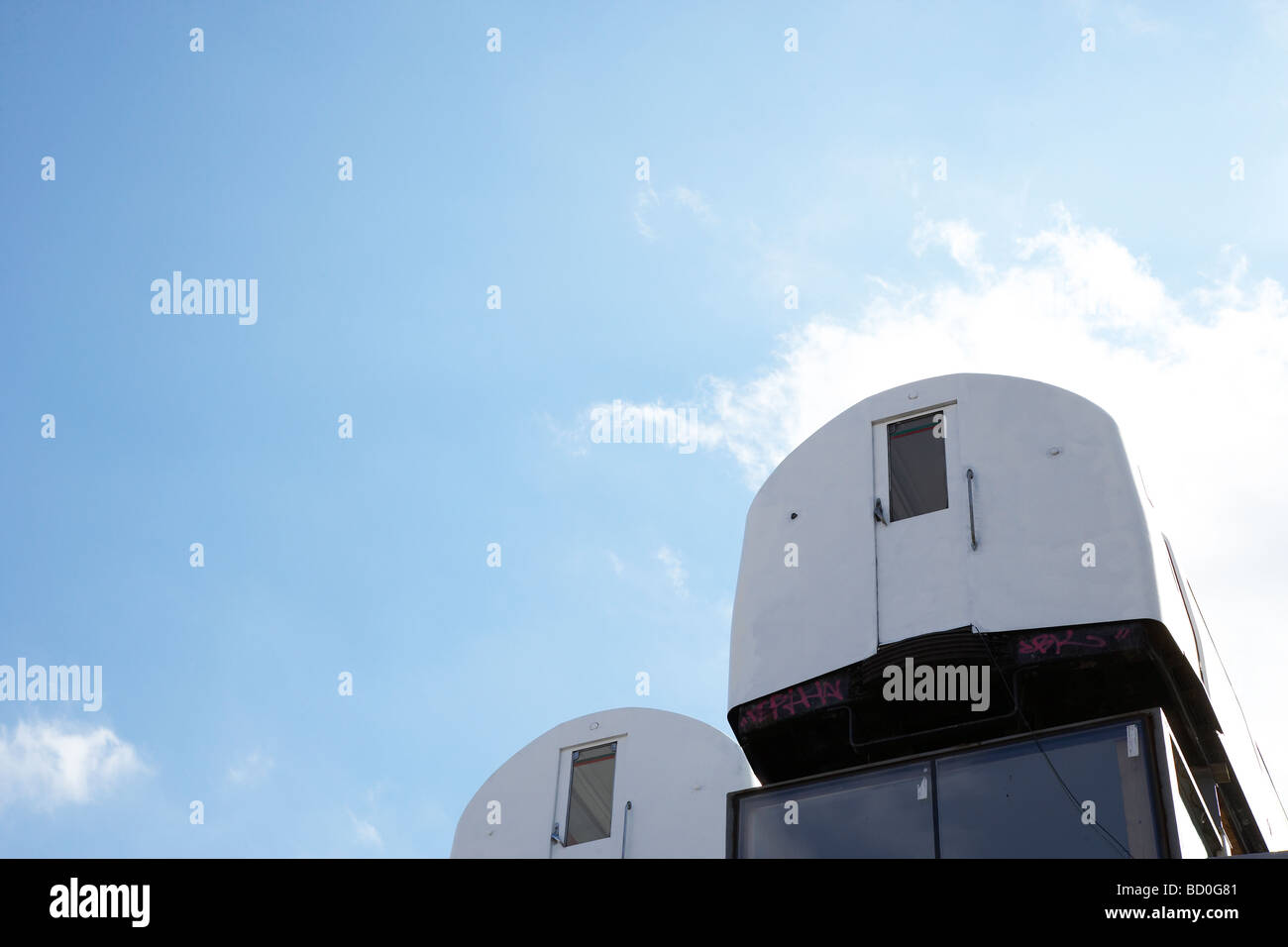 Tube carriages, balanced on top of a building Stock Photo - Alamy