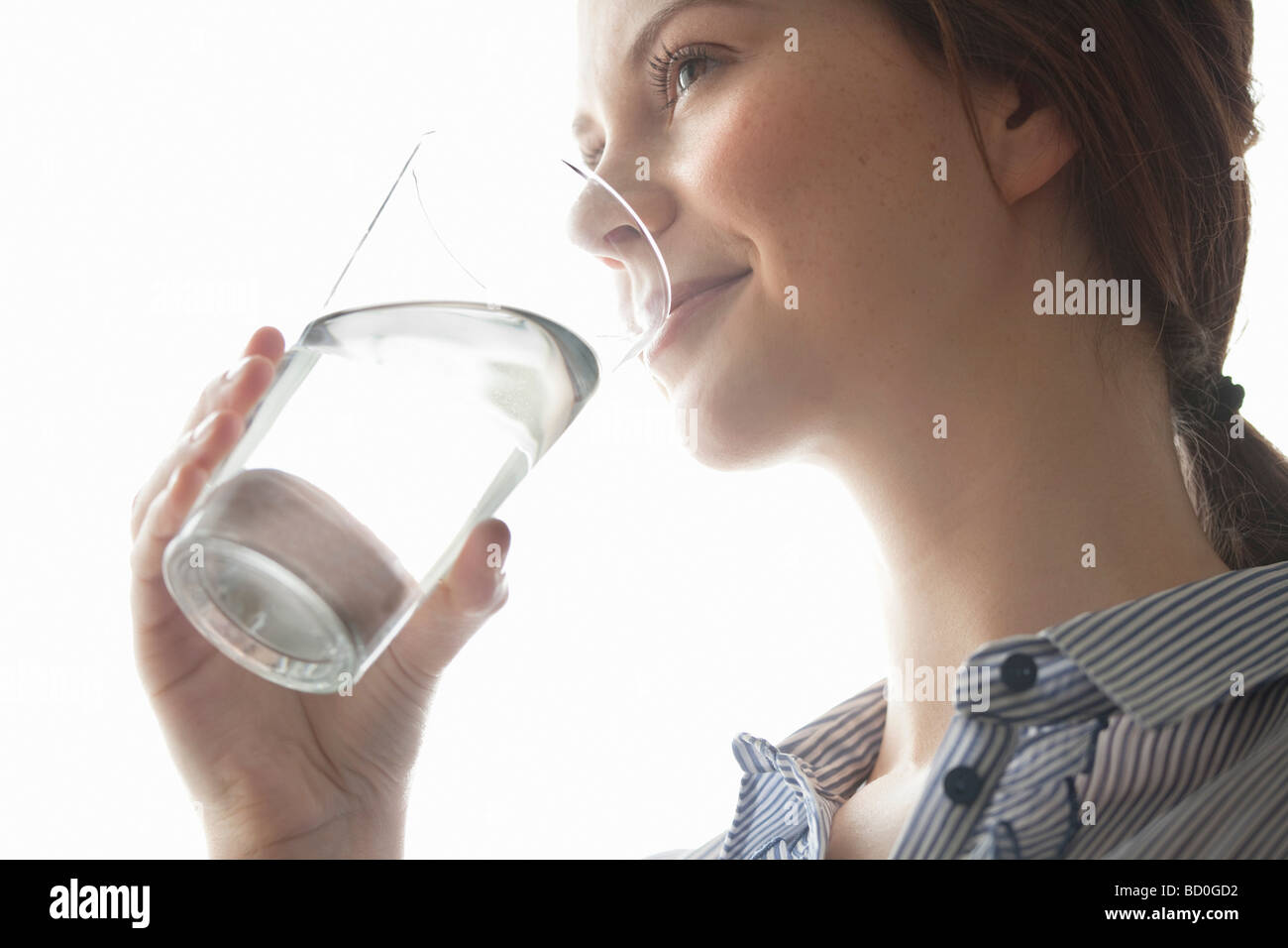 Young women drinking water Stock Photo - Alamy