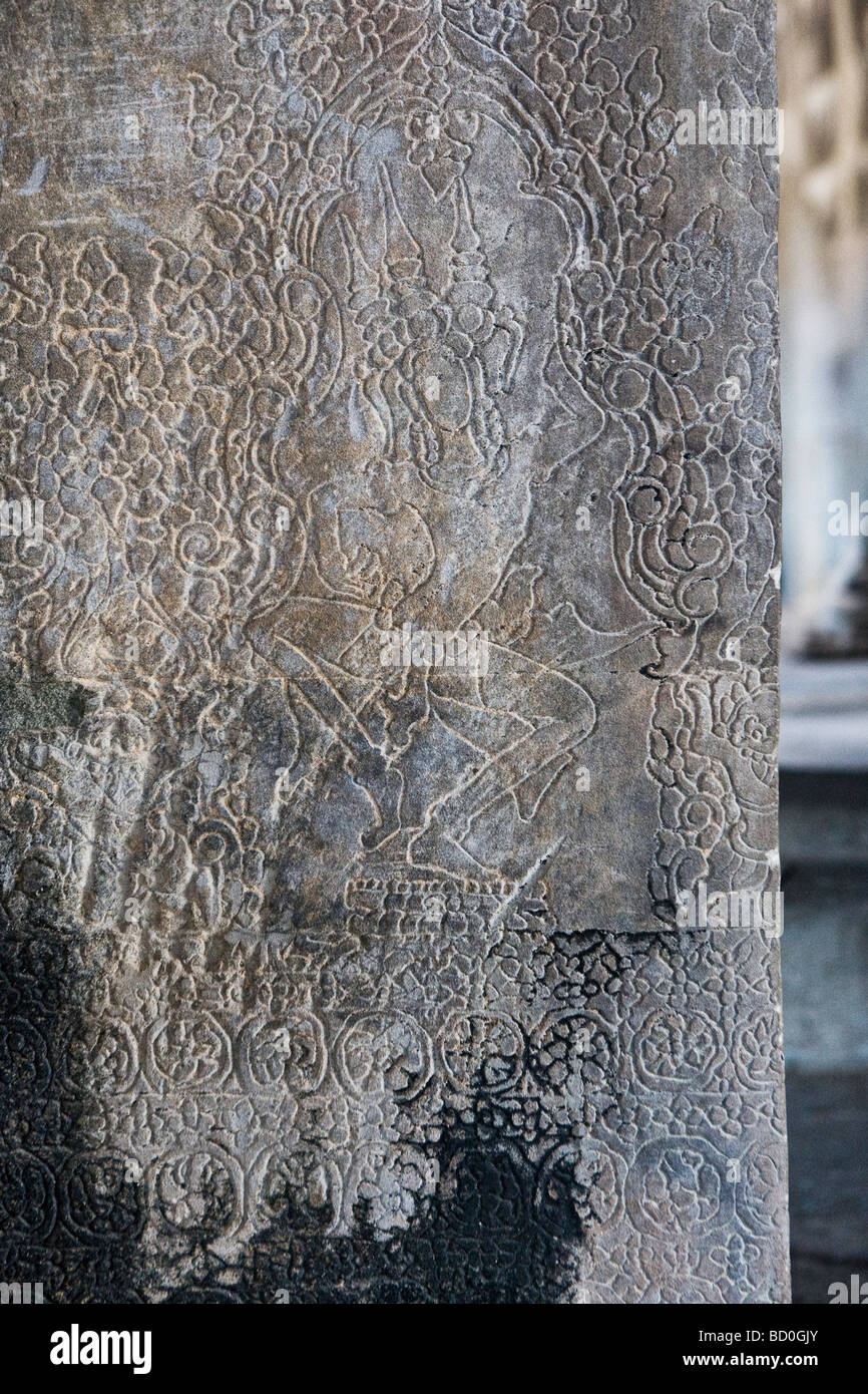 Carved bas relief designs on a temple at Angkor in Cambodia Stock Photo ...