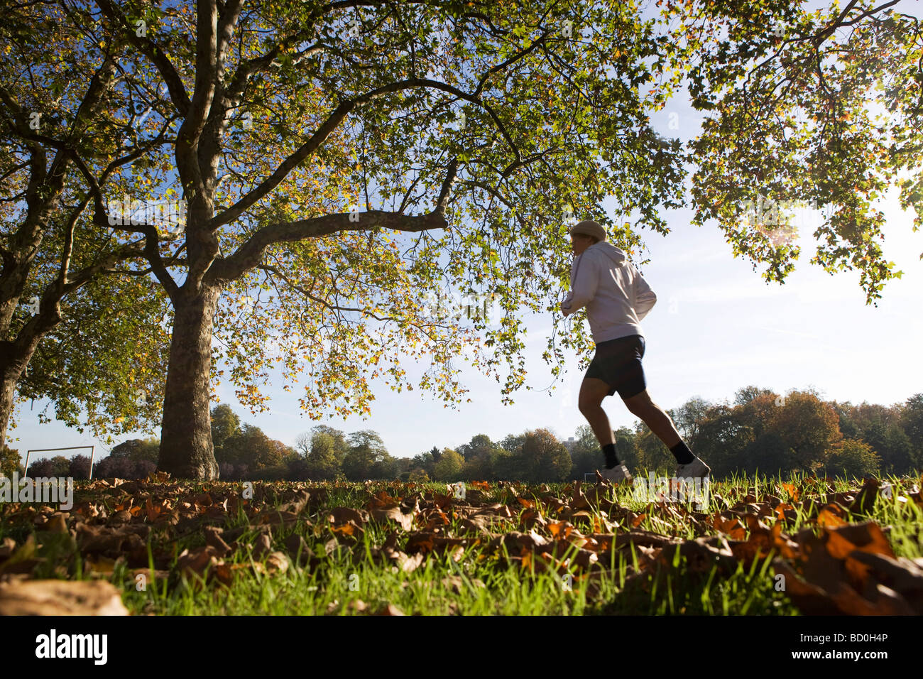 Man running london park hi-res stock photography and images - Alamy