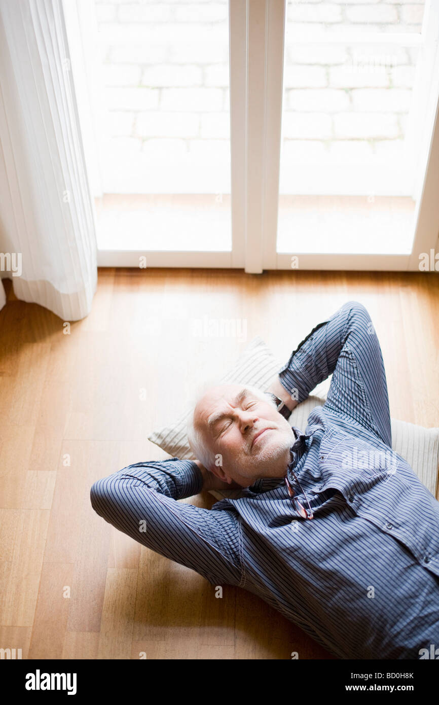old man relaxing on floor Stock Photo - Alamy