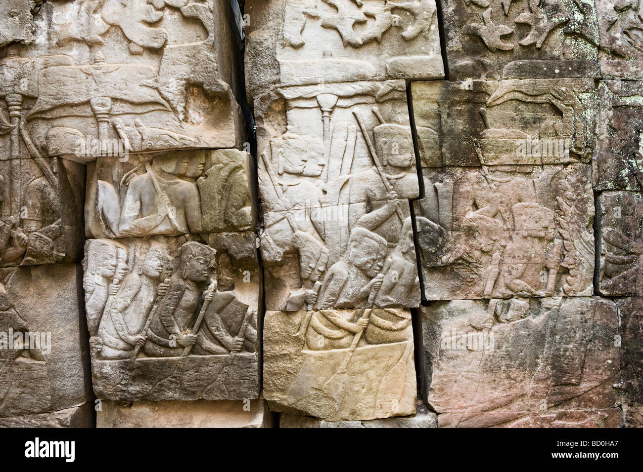 Carved bas relief designs on a temple at Angkor in Cambodia Stock Photo ...