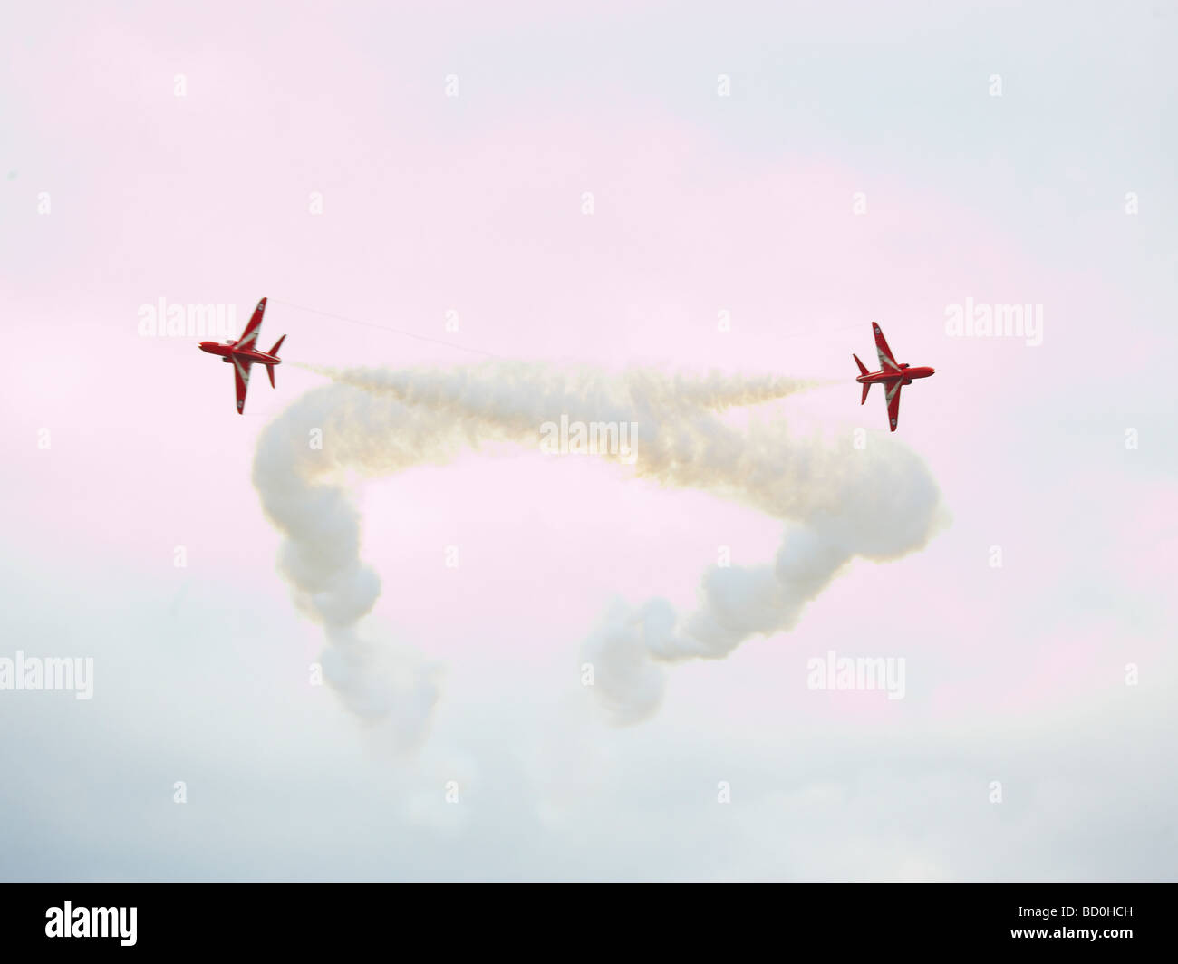 Red arrows during an air display, flying in formation Stock Photo - Alamy