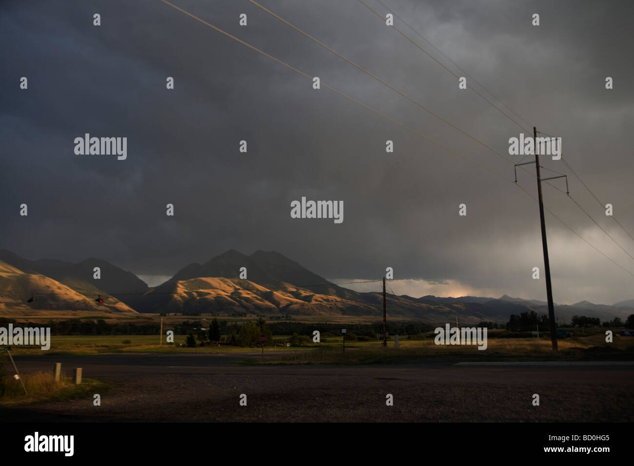 Emigrant Peak mountain is illuminated by the evening sun at a junction ...