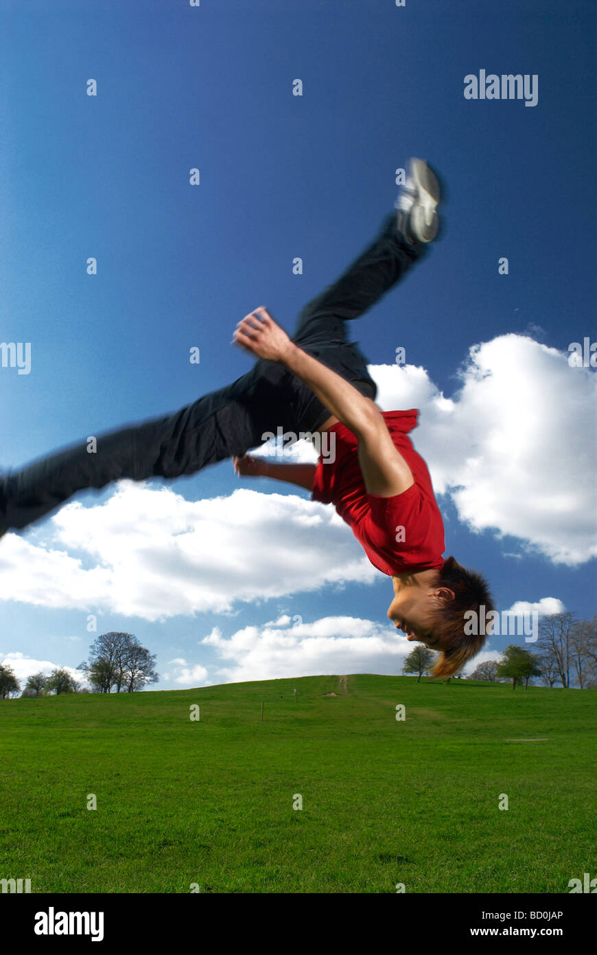 man backflipping in park Stock Photo - Alamy