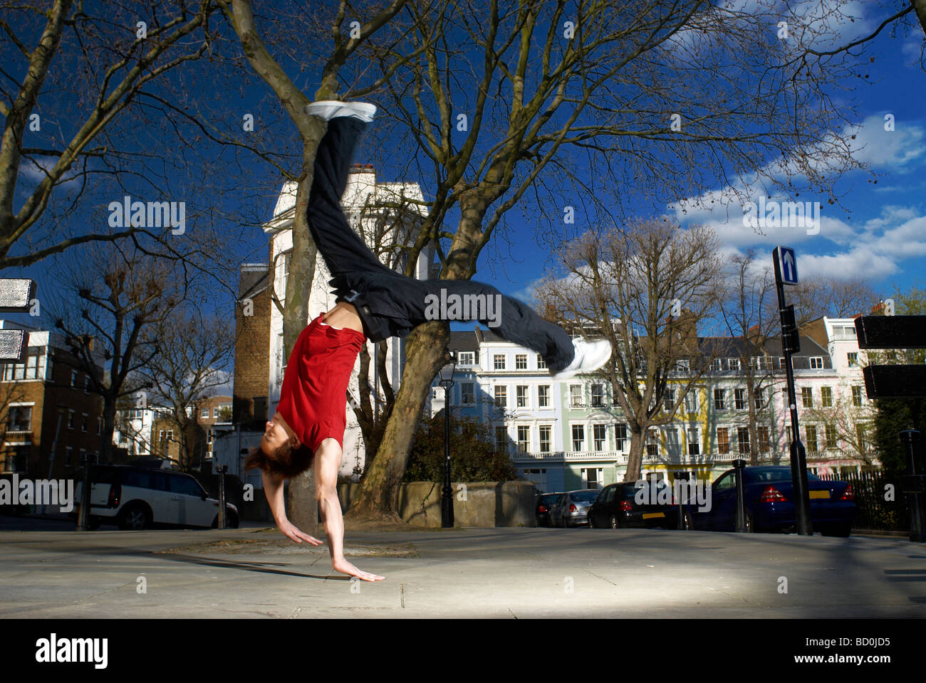 man doing back flip on street Stock Photo - Alamy
