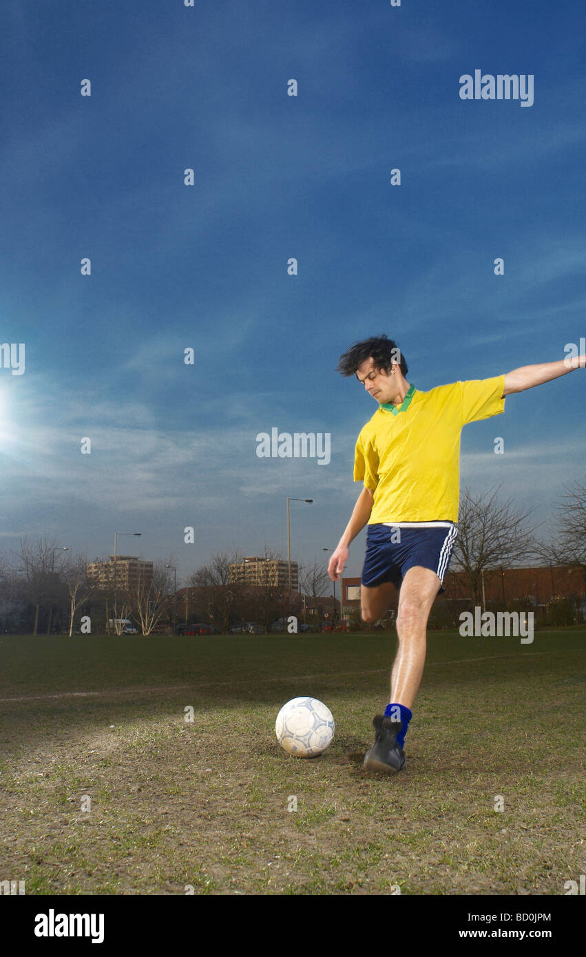 Footballer kicking ball hi-res stock photography and images - Alamy