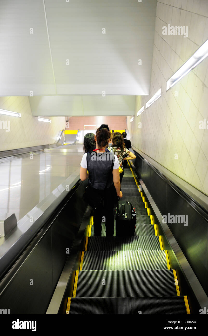 Commuters on their way to a subway metro station in Ginza district ...