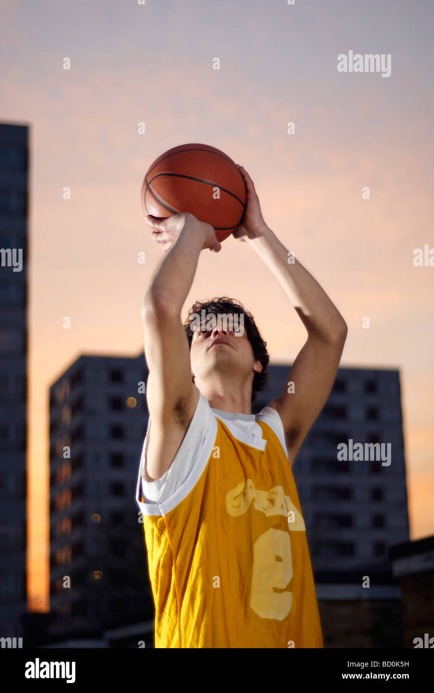 Basketball player taking shot hi-res stock photography and images - Alamy