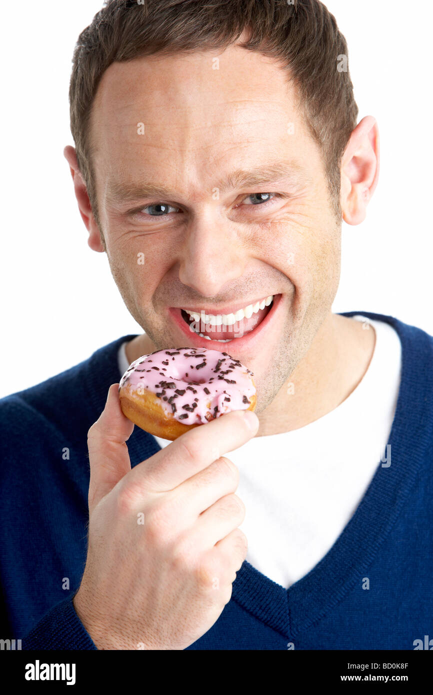 Man biting doughnut hi-res stock photography and images - Alamy