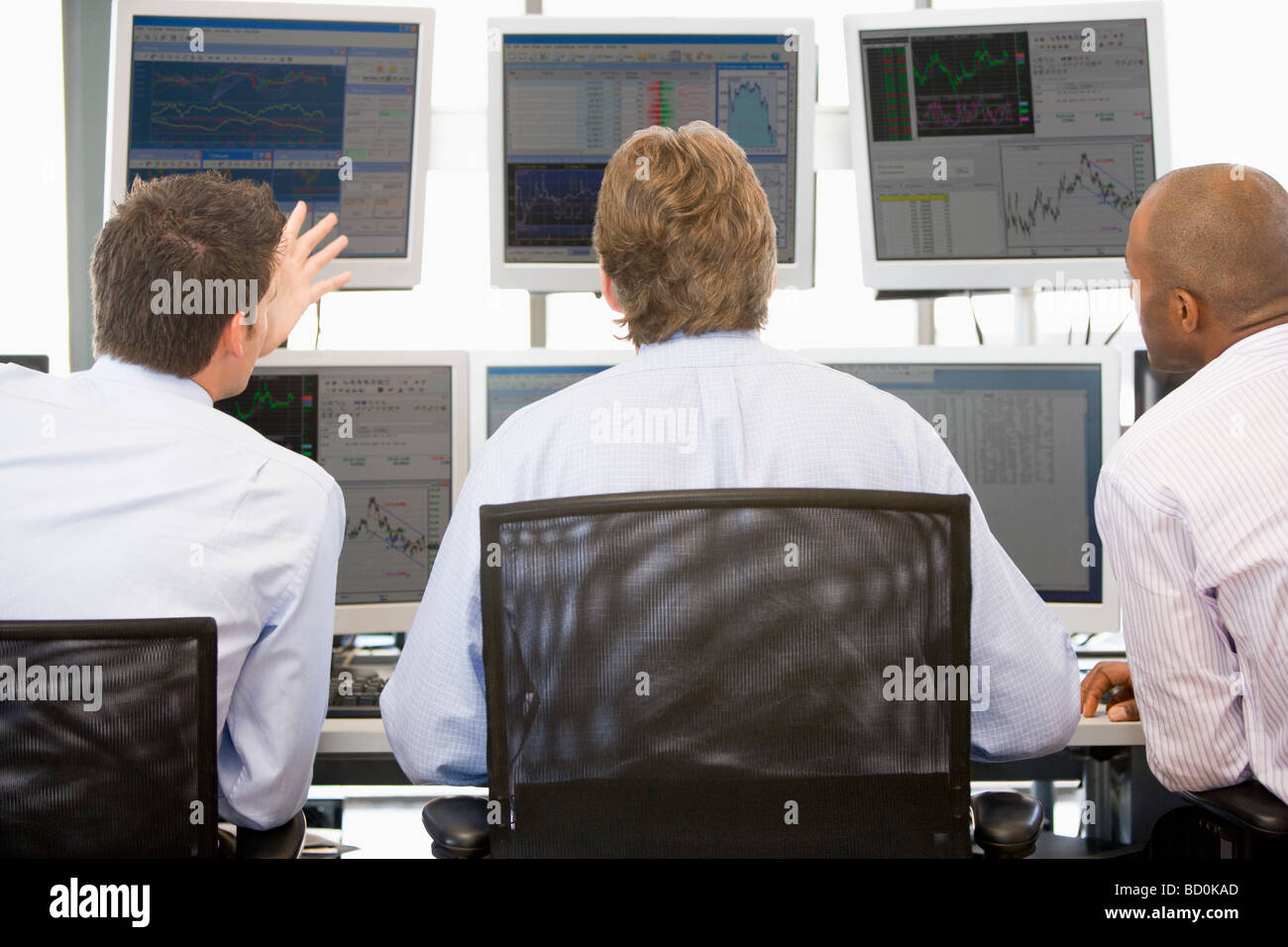 Stock Traders Viewing Monitors Stock Photo - Alamy