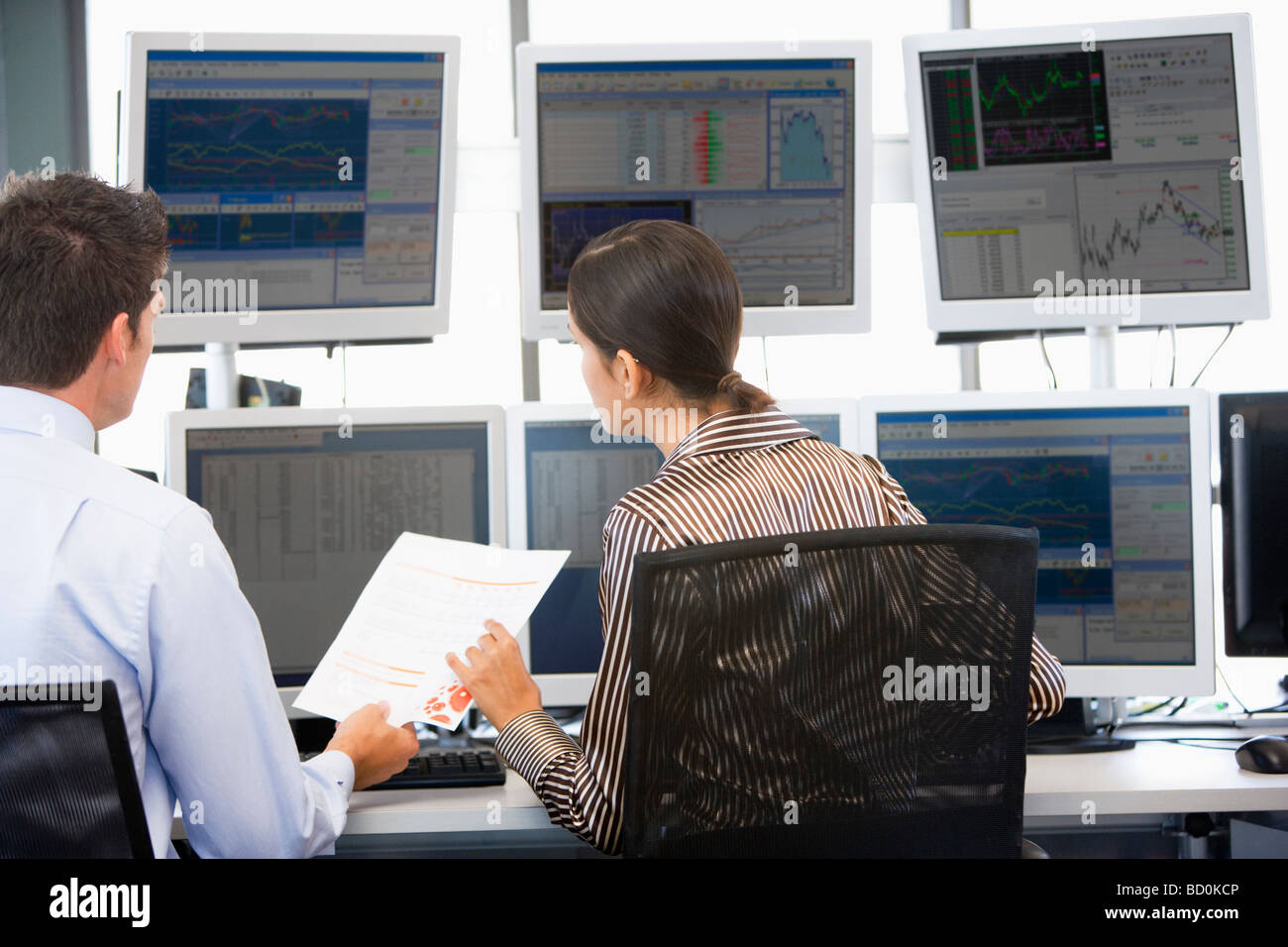 Woman share price stock screen computer hi-res stock photography and ...