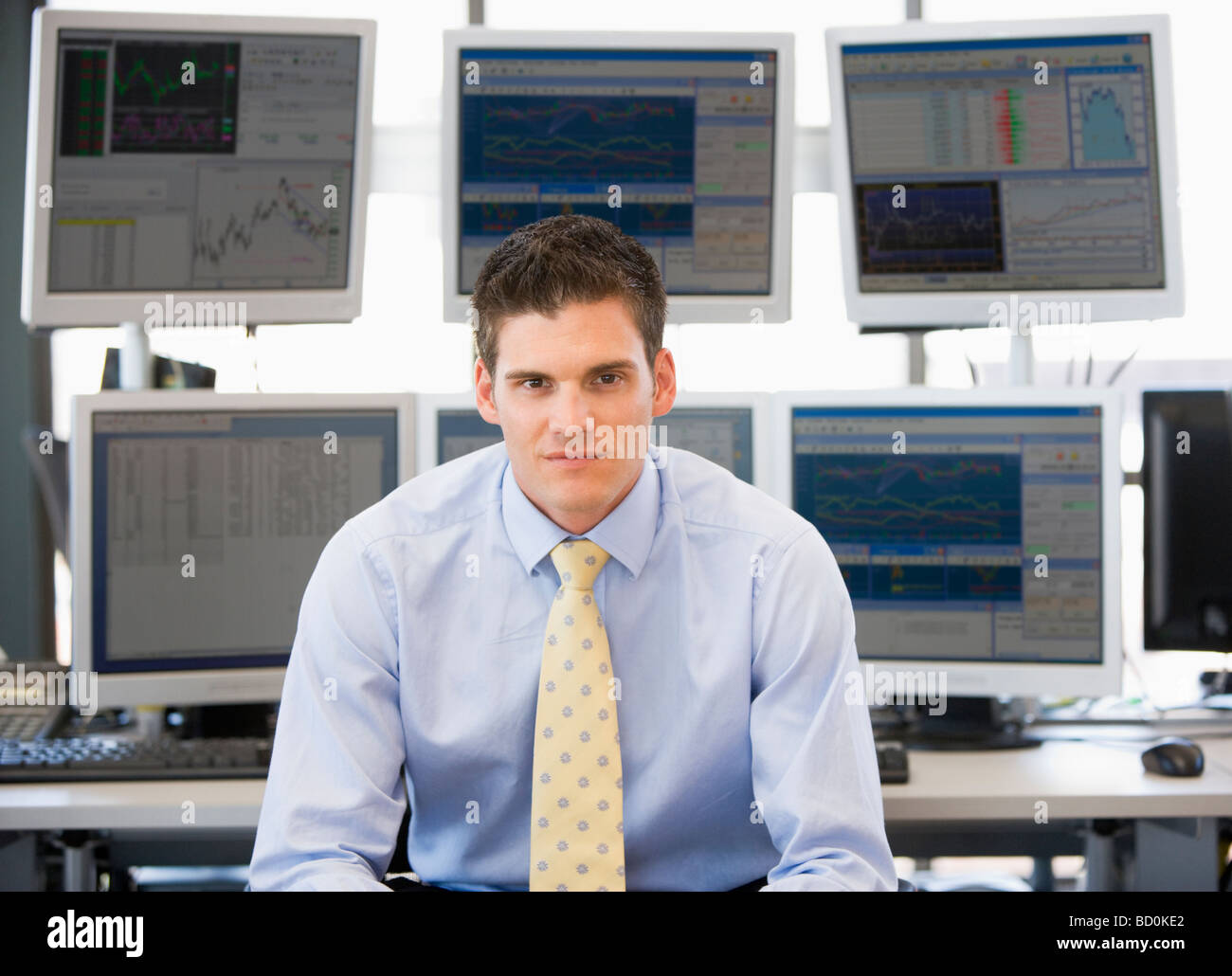 Portrait Of Stock Trader In Front Of Computer Monitors Stock Photo - Alamy