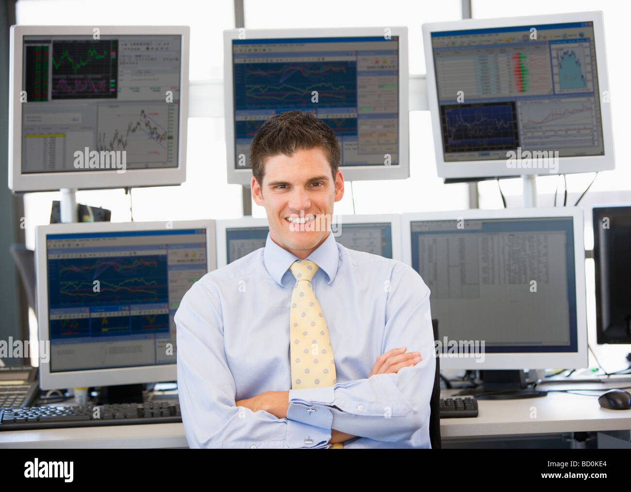 Portrait Of Stock Trader In Front Of Computer Monitors Stock Photo - Alamy