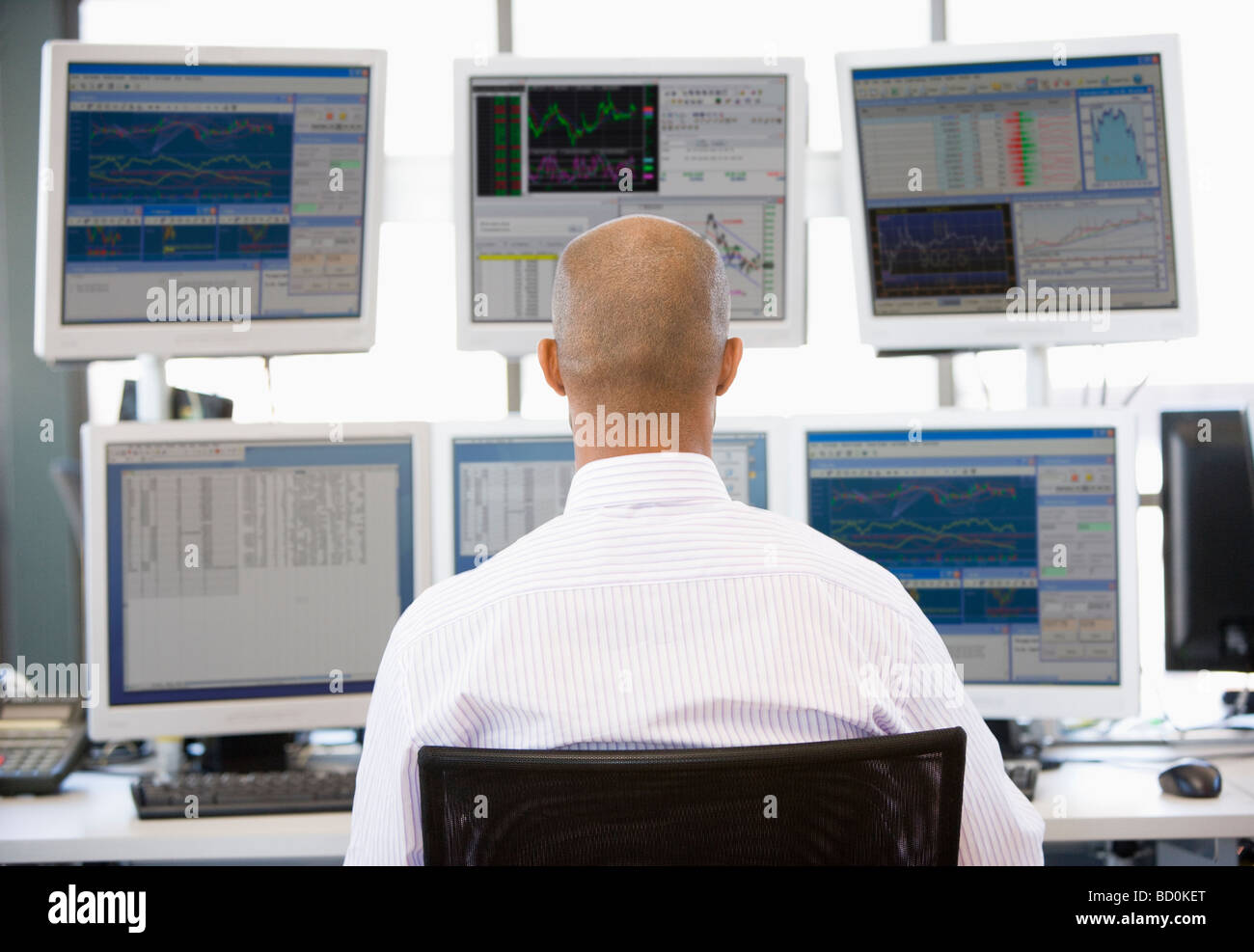 Broker looking at computer screens hi-res stock photography and images - Alamy
