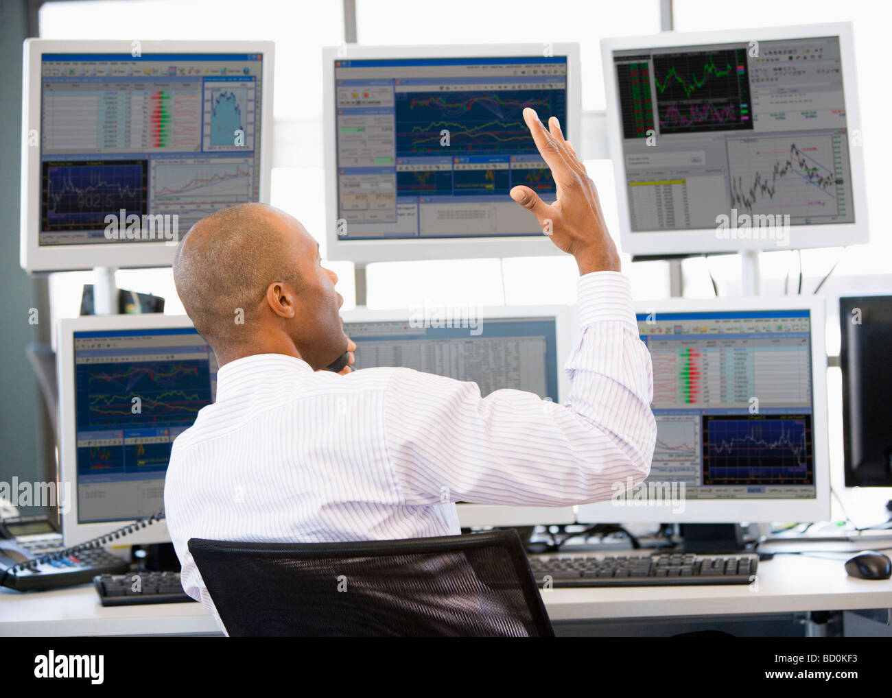 Stock Trader Talking Animatedly On The Phone Stock Photo - Alamy