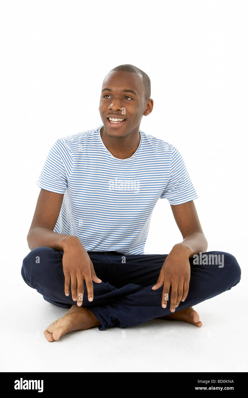 Teenage Boy Sitting In Studio Stock Photo - Alamy