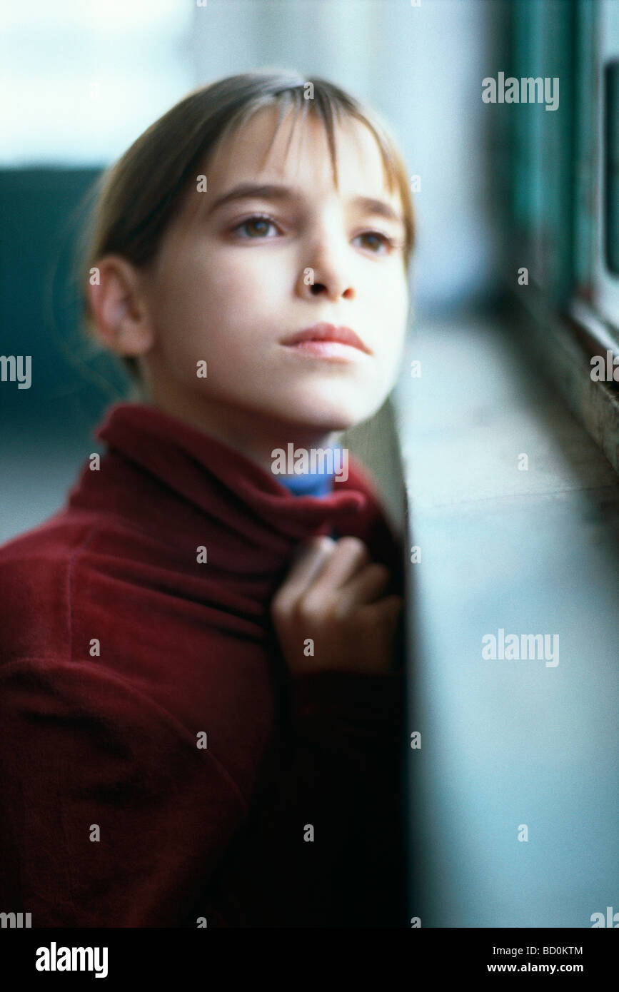 Girl looking out window Stock Photo - Alamy