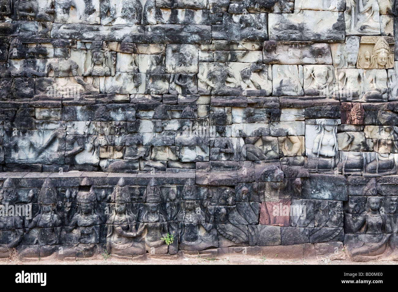 Carved bas relief designs on a temple at Angkor in Cambodia Stock Photo ...