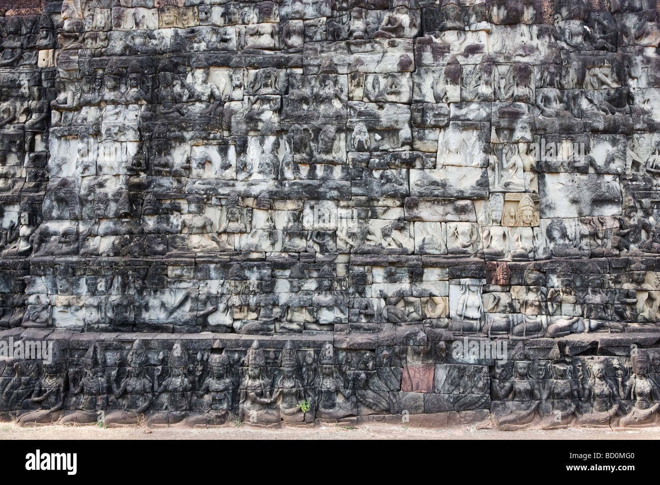 Carved bas relief designs on a temple at Angkor in Cambodia Stock Photo ...