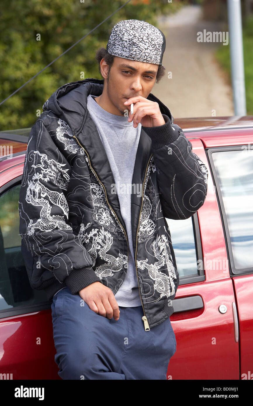 Young Man Standing Next To Car Stock Photo - Alamy