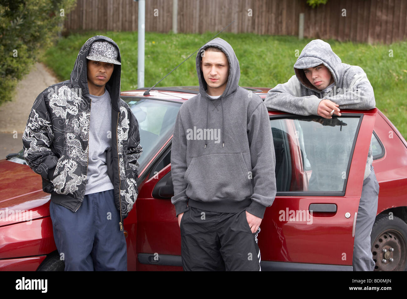 Group Of Young Men With Cars Stock Photo - Alamy