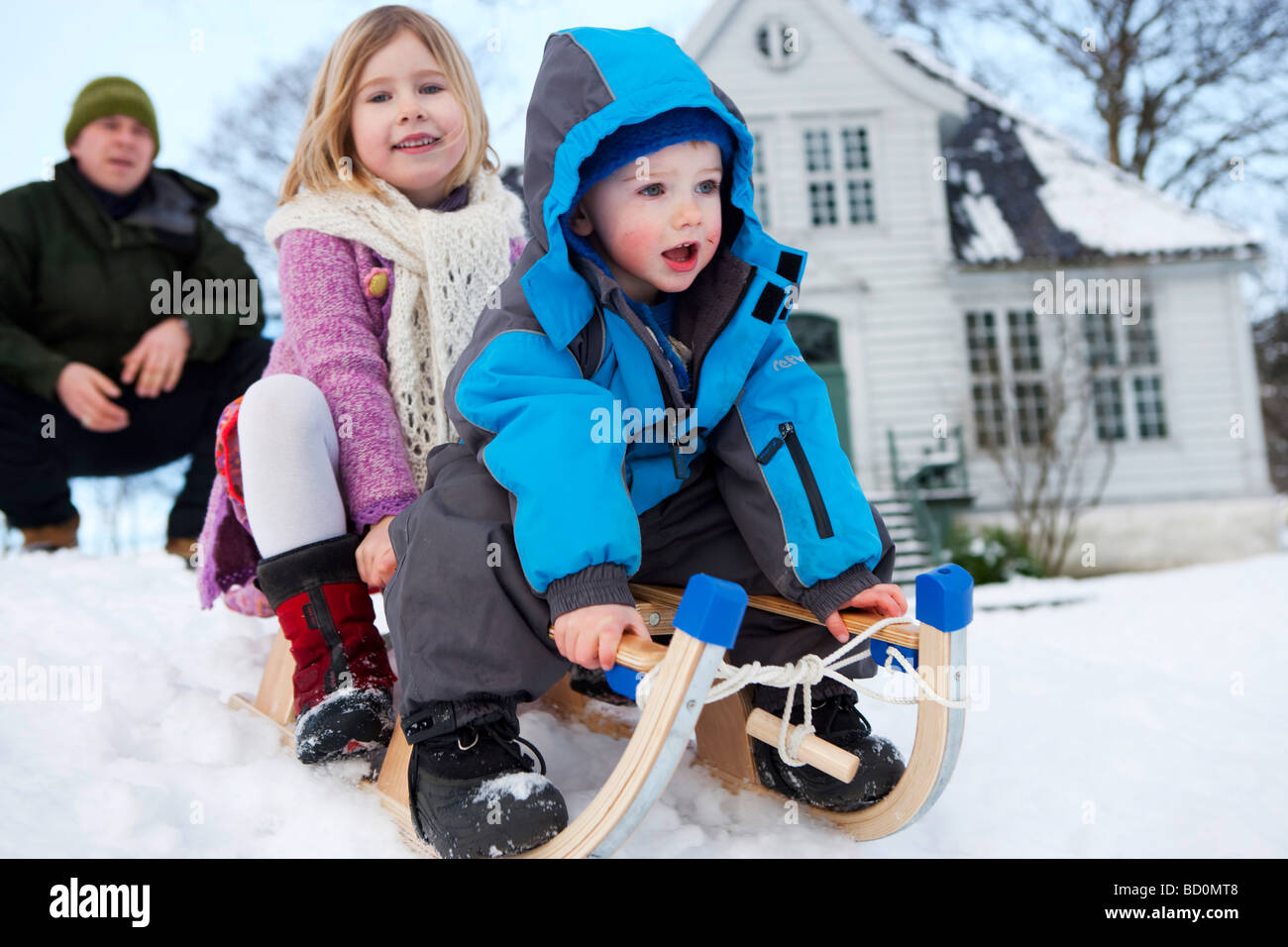 Scandinavian children on a sled Stock Photo - Alamy