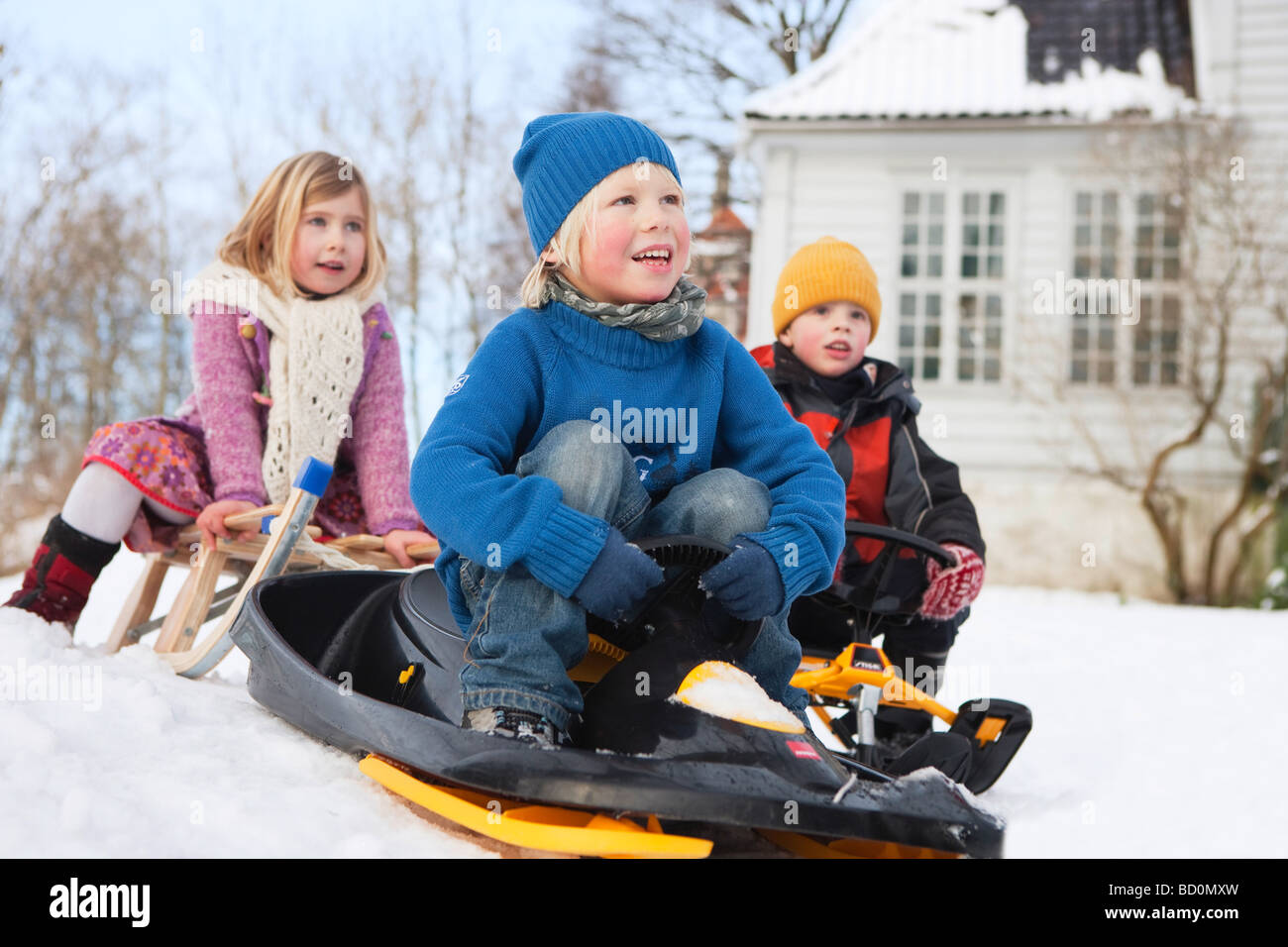 Scandinavian children on sleds Stock Photo - Alamy