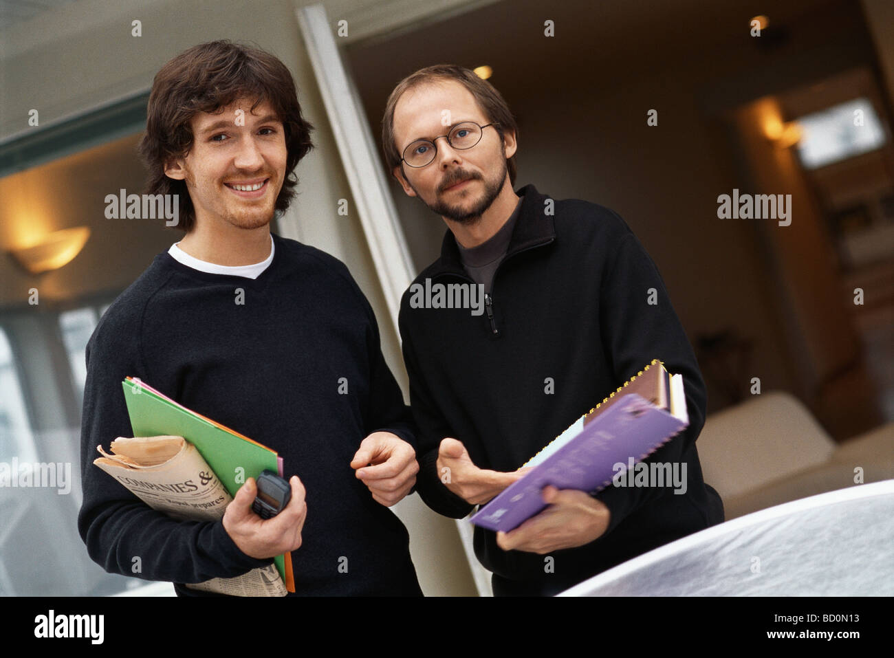 Professional colleagues collaborating in hi-res stock photography and ...