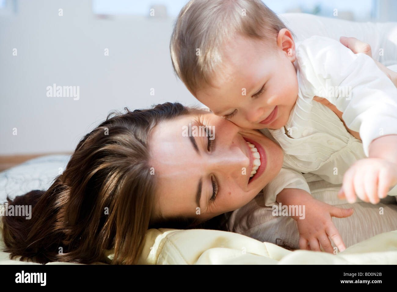 Cuddling mom and youngster hi-res stock photography and images - Alamy