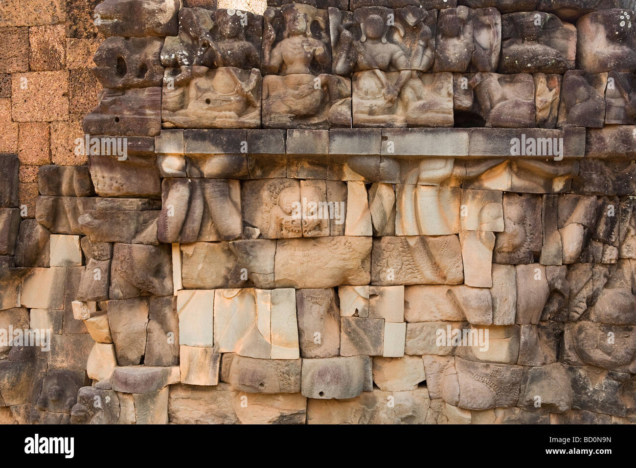 Carved bas relief designs on a temple at Angkor in Cambodia Stock Photo ...