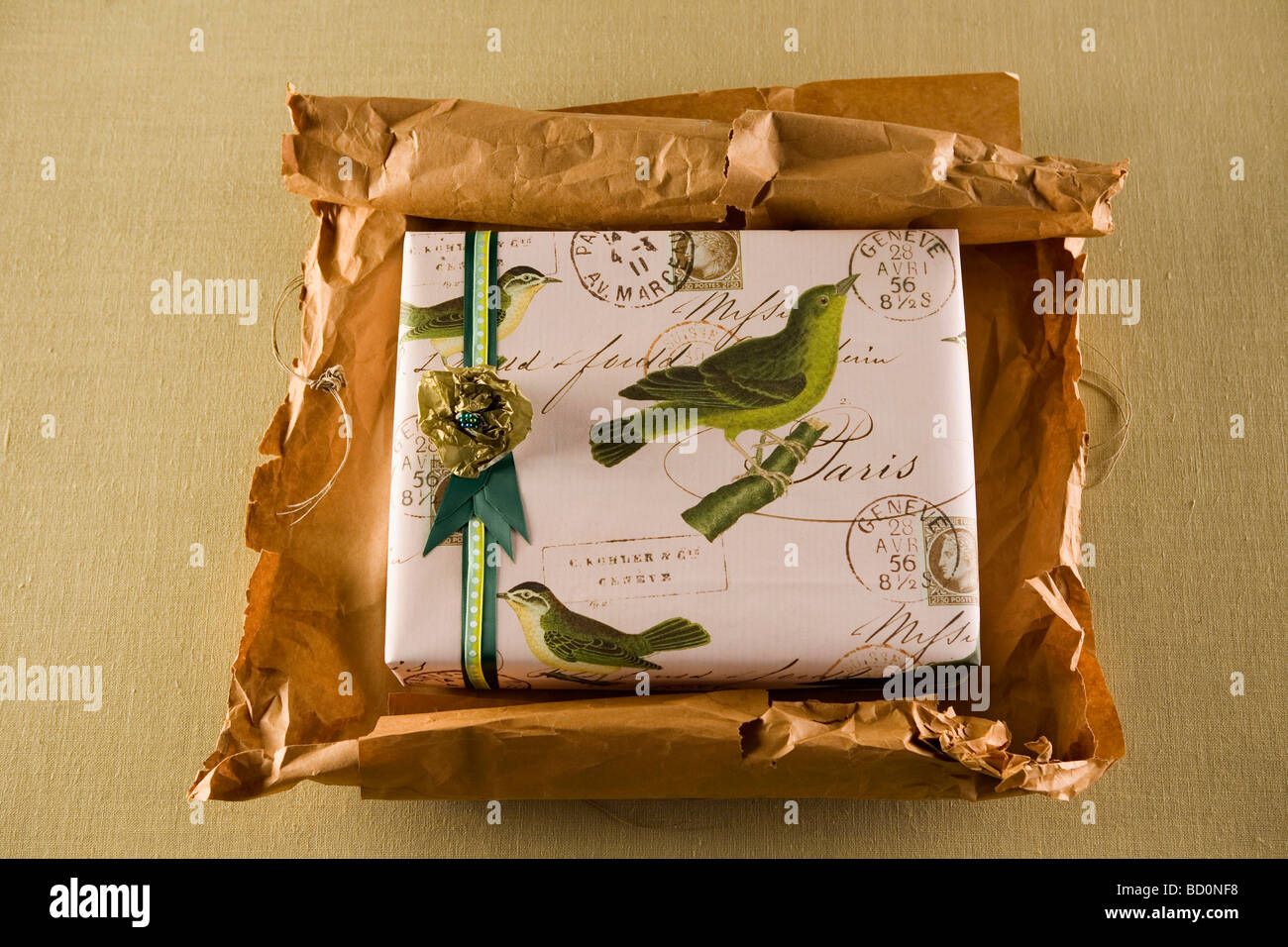 Parcel with gift being unwrapped Stock Photo - Alamy