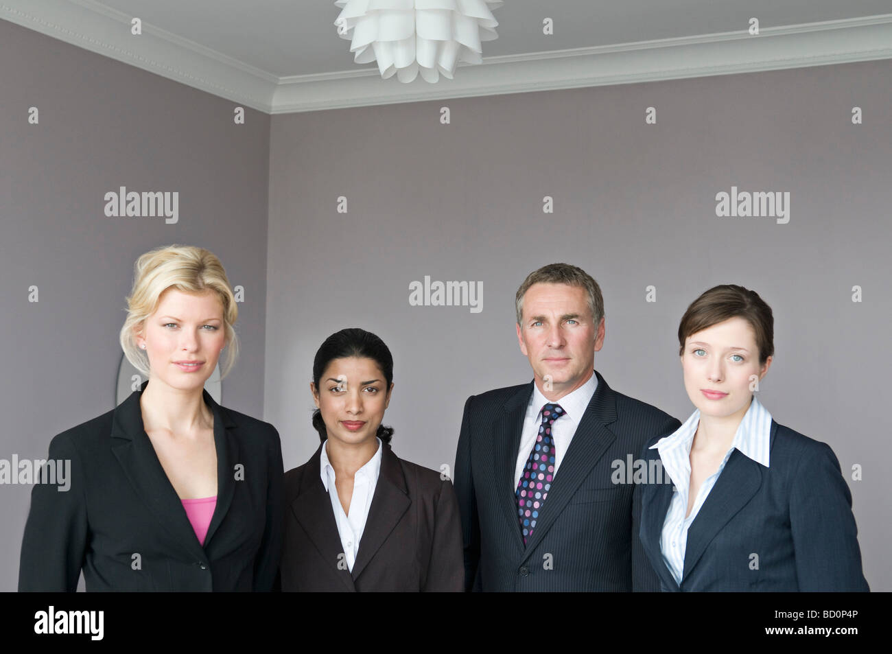 Four business people hi-res stock photography and images - Alamy