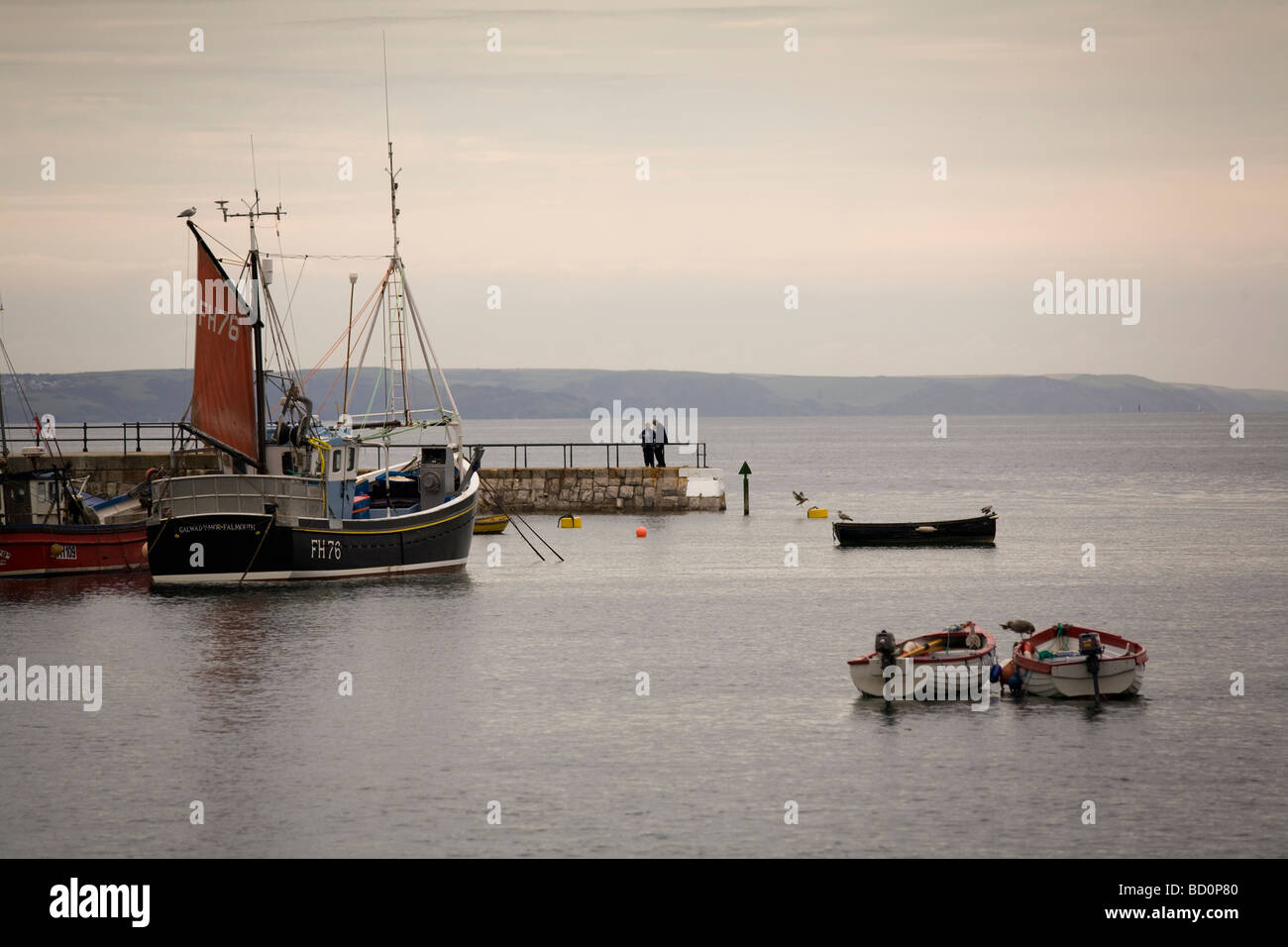 Fishing boats in a Cornish harbour Stock Photo - Alamy
