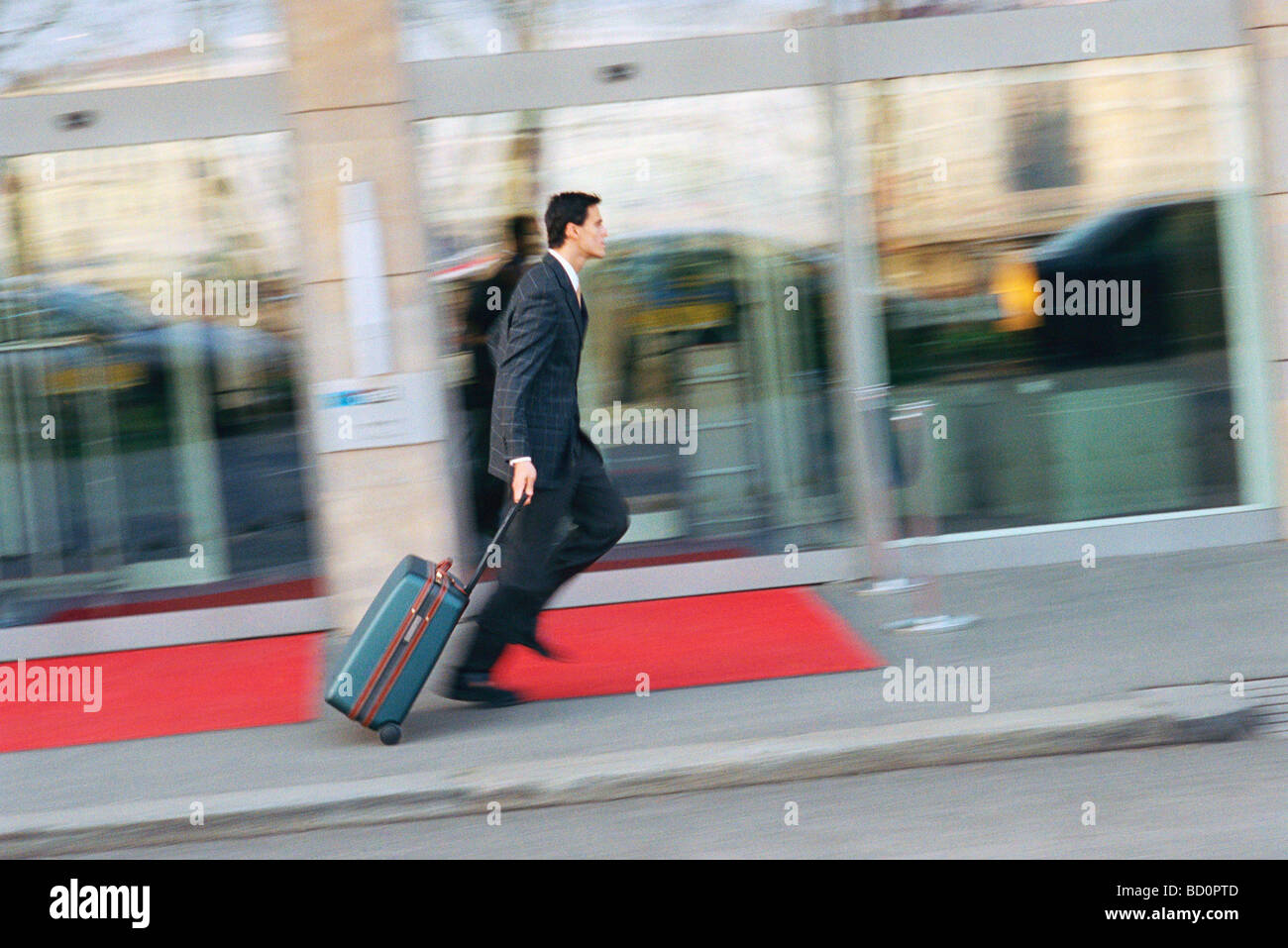 Man running late with suitcases hi-res stock photography and images - Alamy