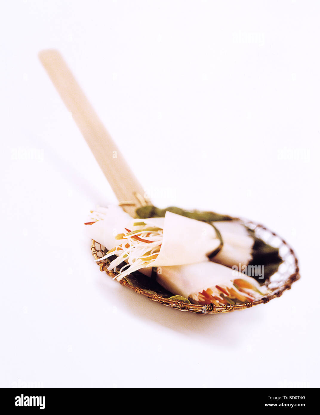 big ladle with rice paper parcels Stock Photo - Alamy