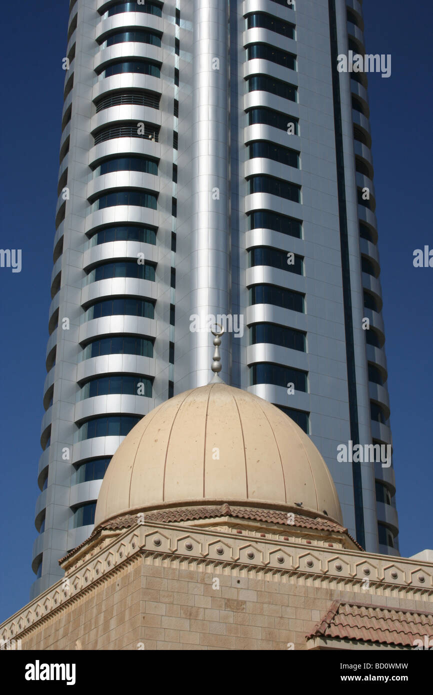 Boubyan Bank Kuwait Headquarters with Mosque Minaret Stock Photo - Alamy