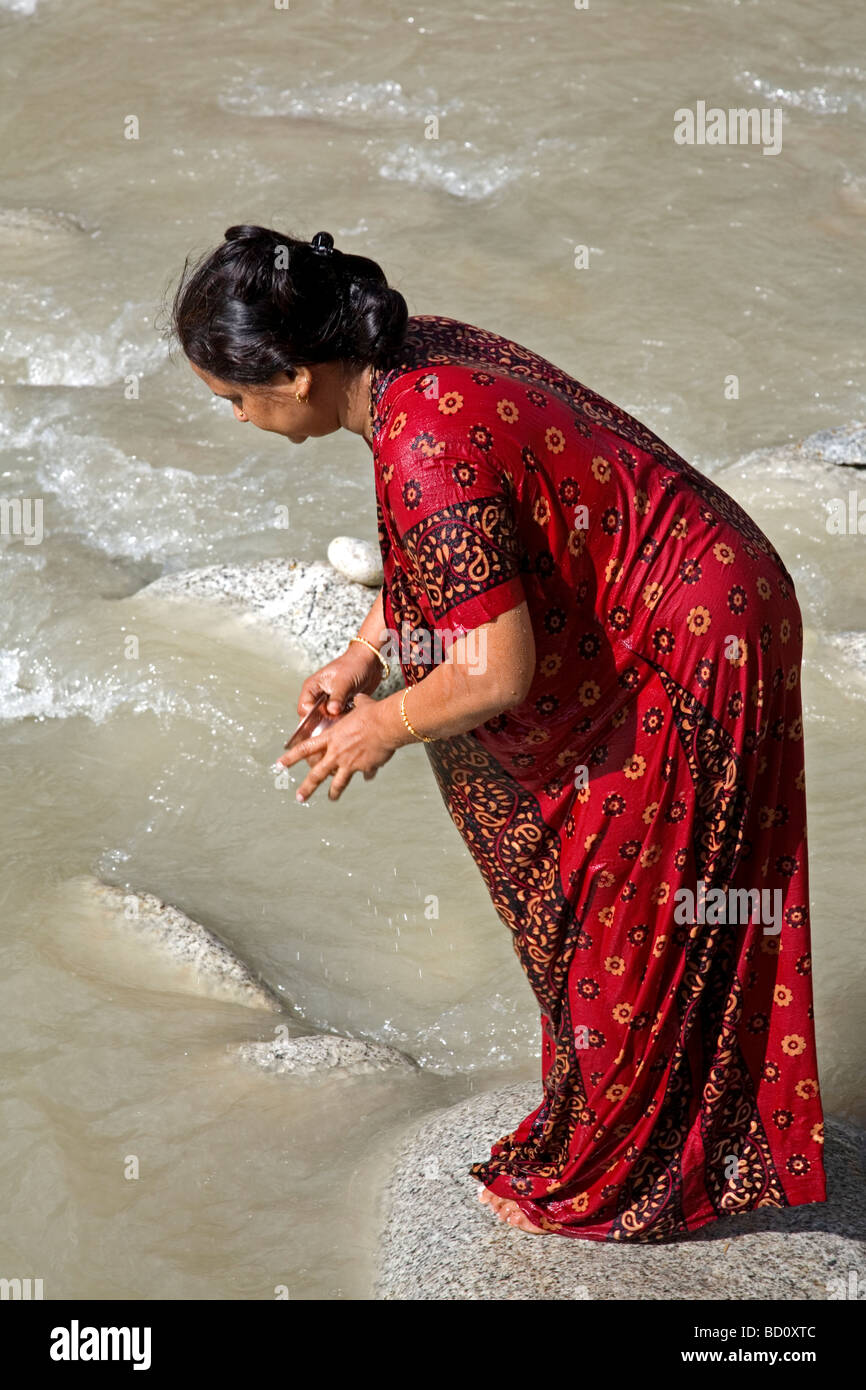 Indian woman making the ritual ablutions. Ganges river. Gangotri. India ...