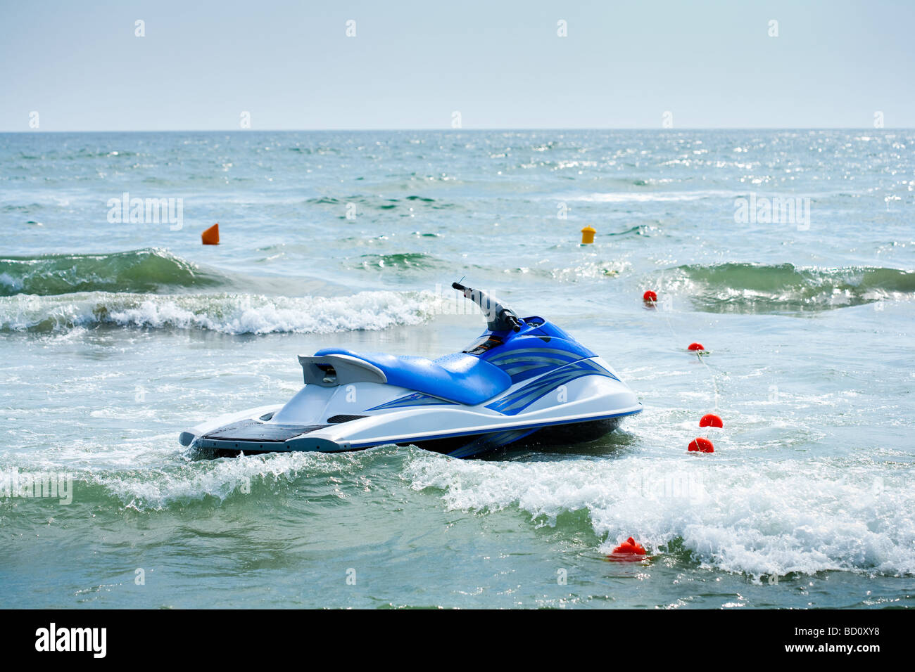 Blue jet ski on the water Stock Photo - Alamy