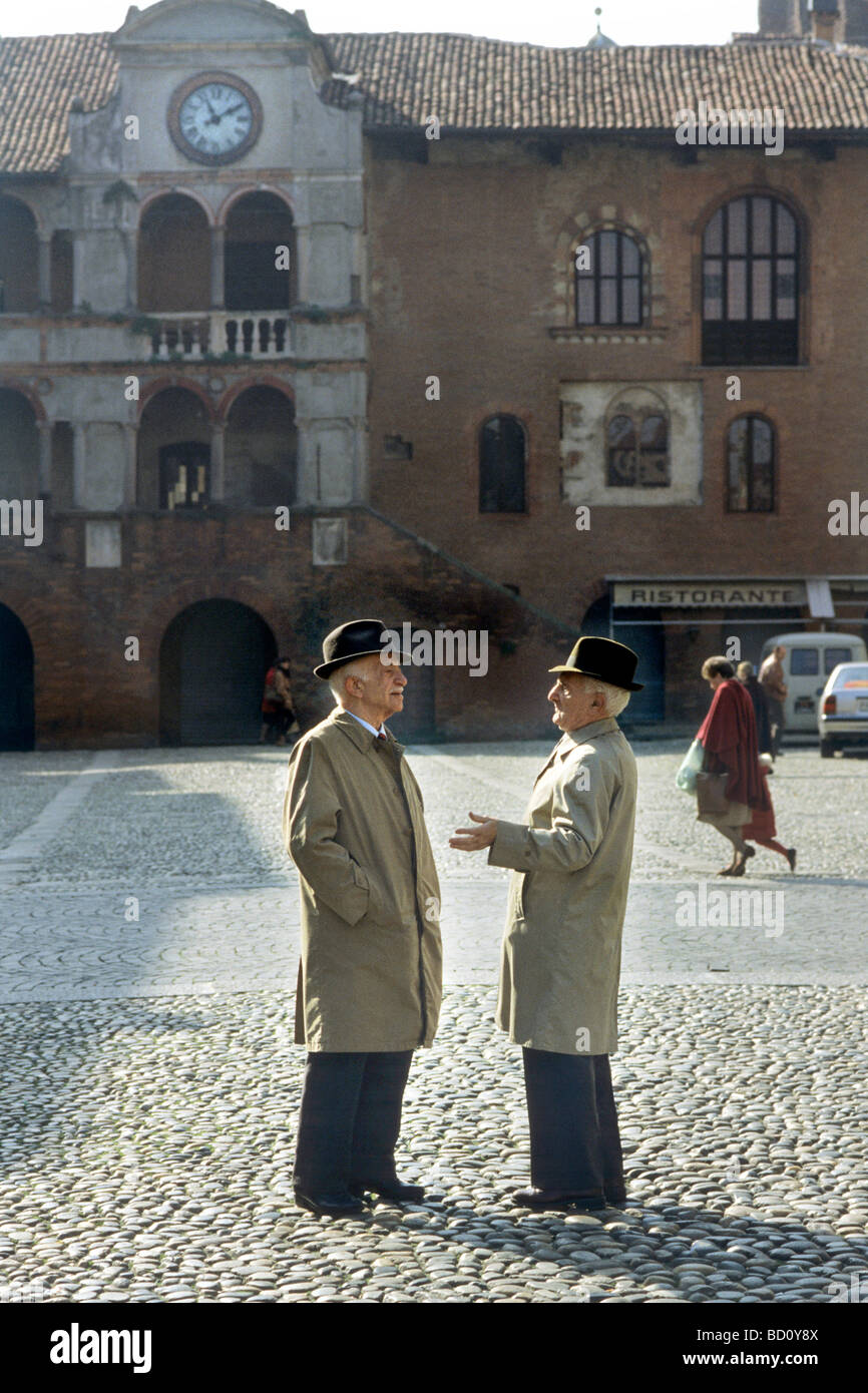 Elderly people talking in Piazza della Vittoria Pavia Italy Stock Photo ...