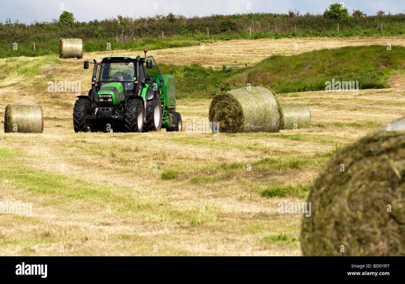 Tractor Making Bales Stock Photo - Alamy