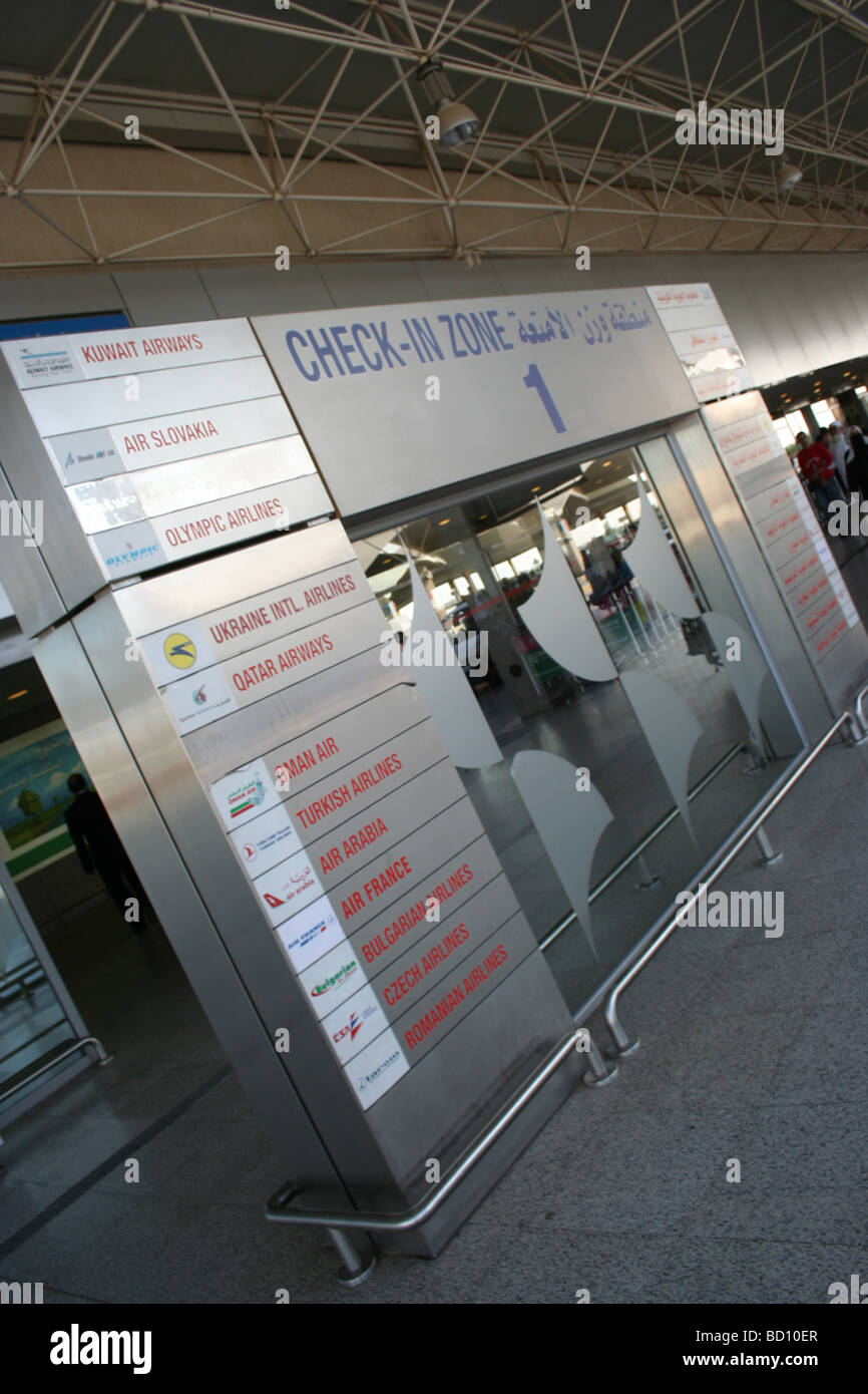 Kuwait City Airport Check In Zone airline sign Stock Photo - Alamy